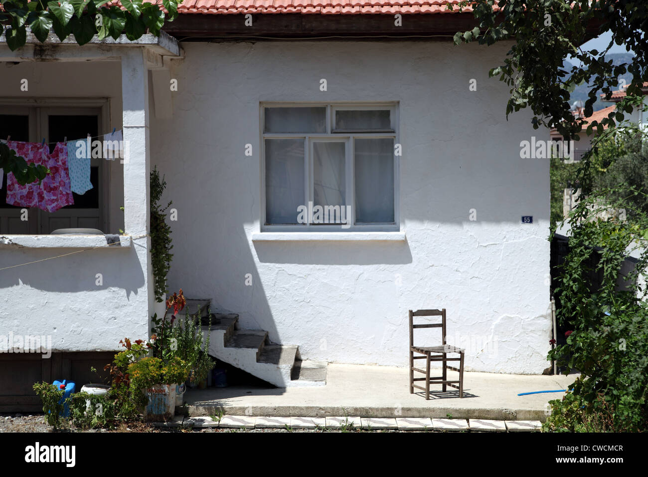 wooden chair on porch of typical Turkish house, Dalyan Turkey; white ...