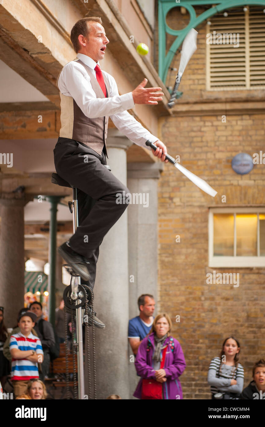 London Covent Gardens Market juggler performer entertainer monocycle ...
