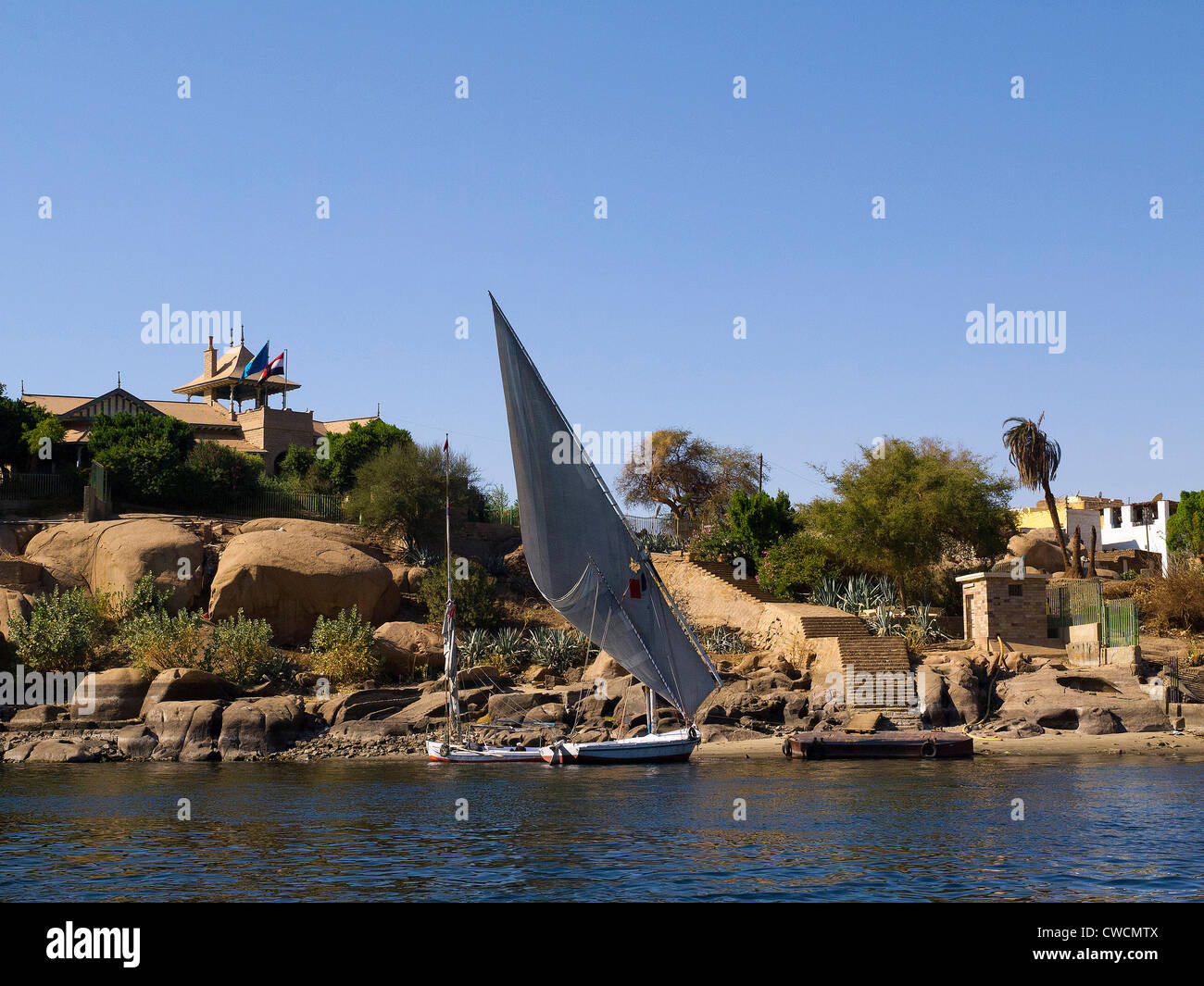 Feluccas on the River Nile near to Aswan in Egypt. Feluccas are the ...