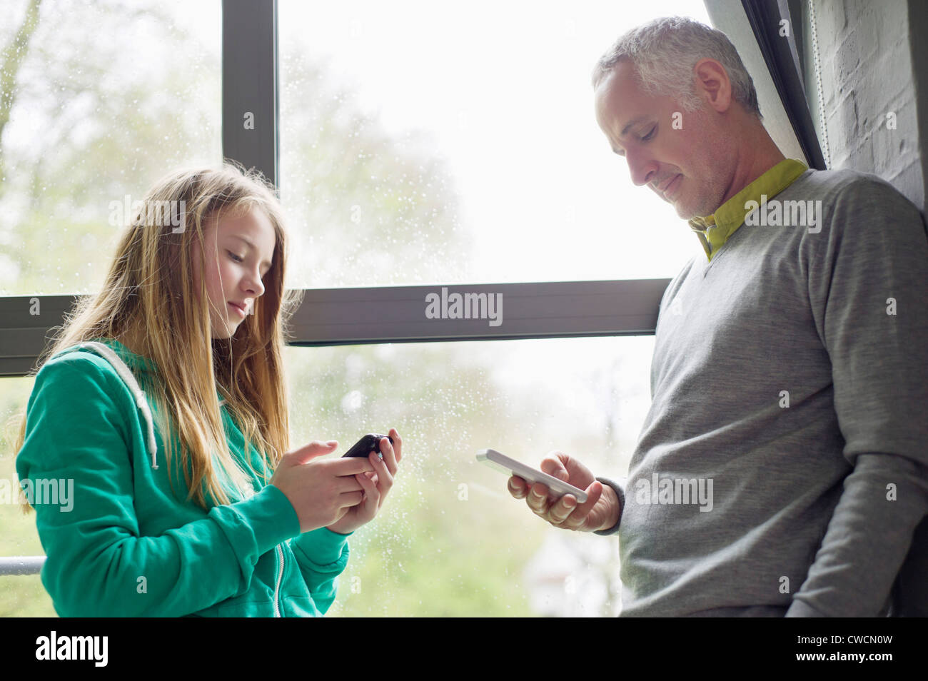 Men child mobile phones hi-res stock photography and images - Alamy