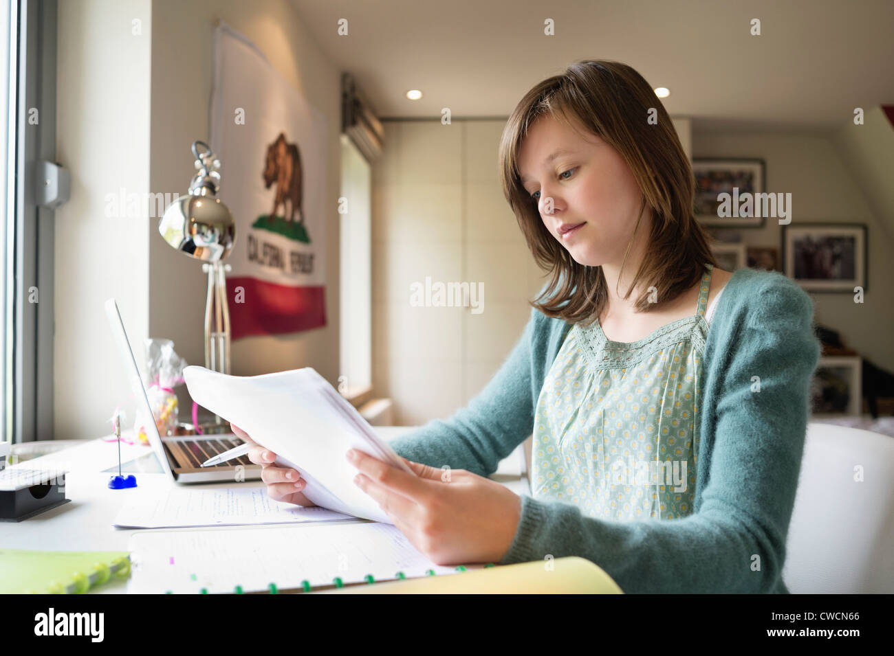 Girl studying at home Stock Photo - Alamy