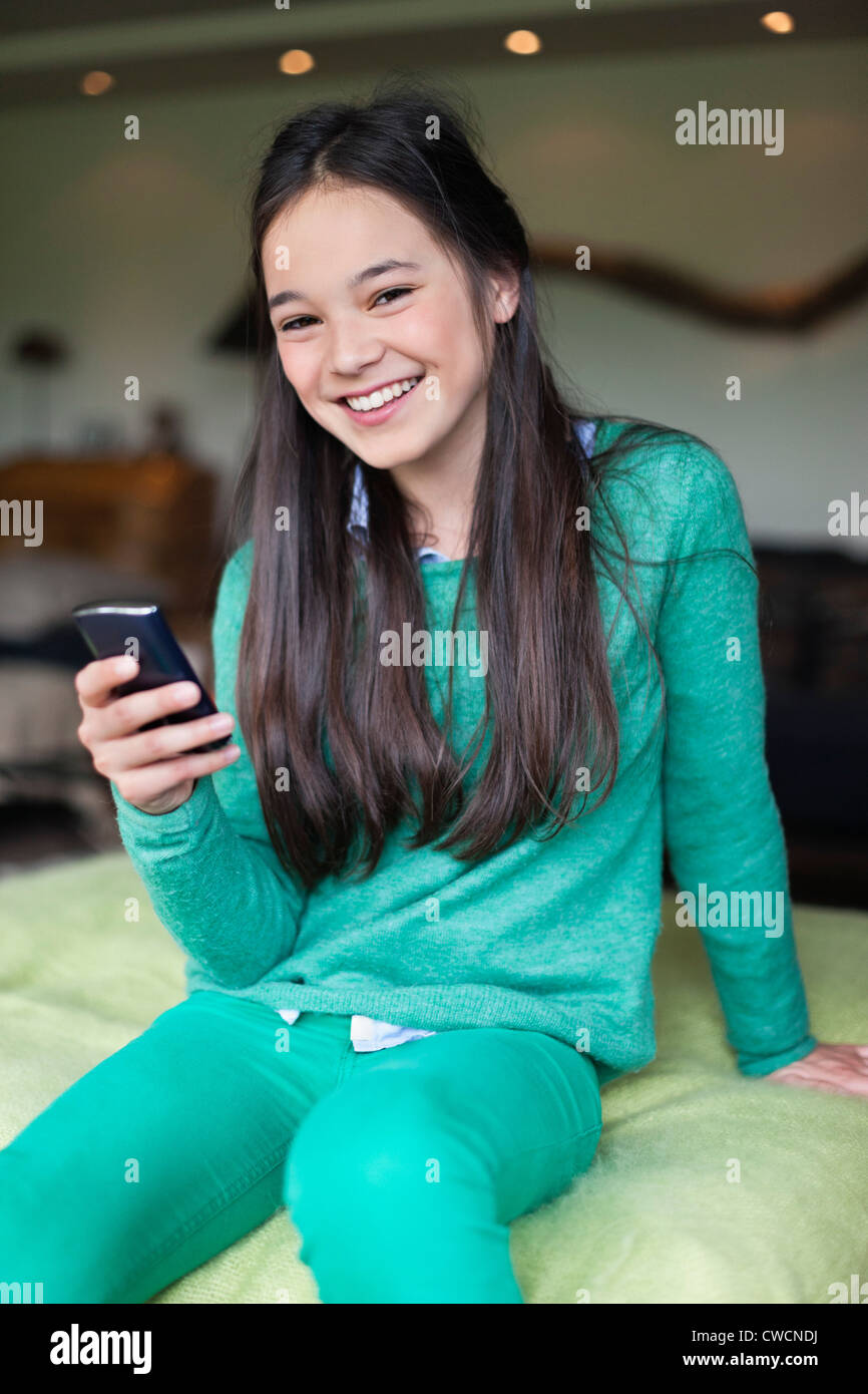 Portrait of a girl using a mobile phone Stock Photo - Alamy