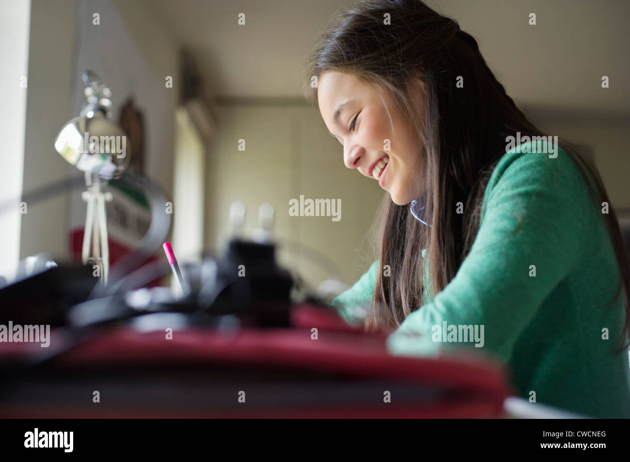 Girl studying at home Stock Photo - Alamy