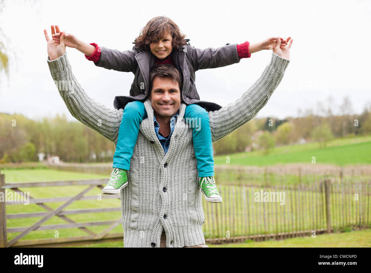 Man carrying his son on shoulders Stock Photo - Alamy