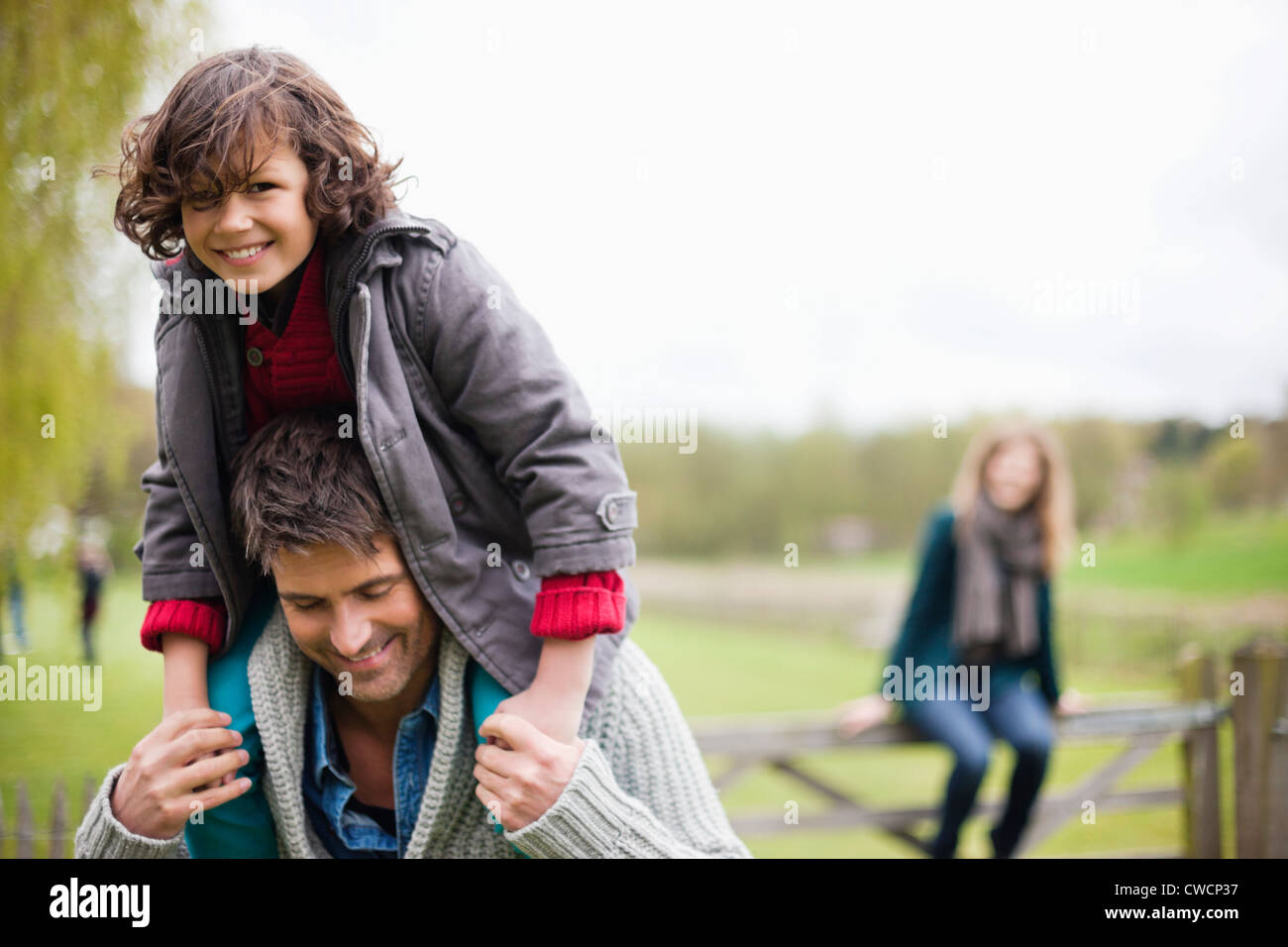 Man carrying his son on shoulders Stock Photo - Alamy