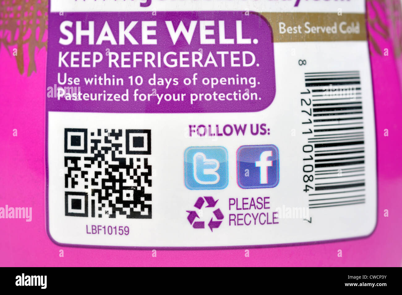QR code and Follow Us on Twitter and Facebook signs on juice bottle ...