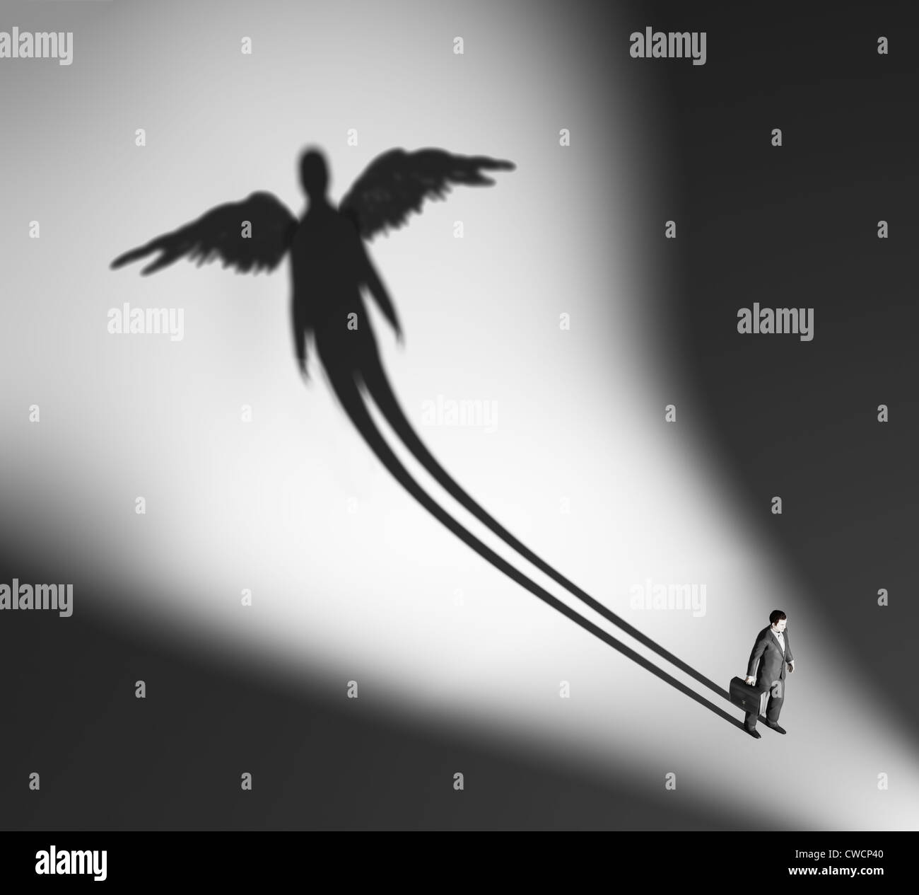Business man cating a winged silhouette shadow Stock Photo - Alamy