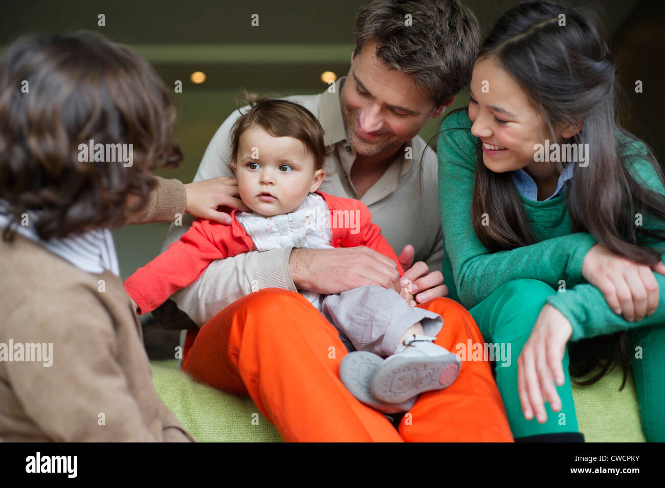 Happy man with their children at home Stock Photo - Alamy