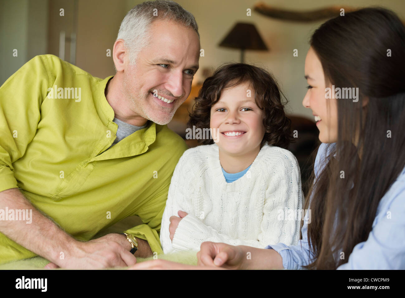 Close-up of a man with his children smiling Stock Photo - Alamy