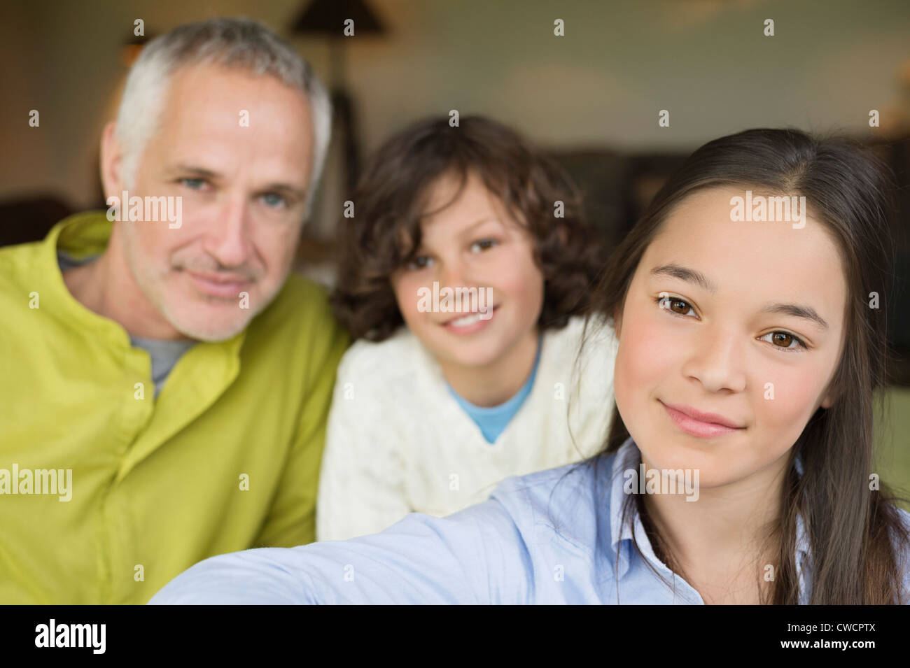 Portrait of a man with his children smiling Stock Photo - Alamy
