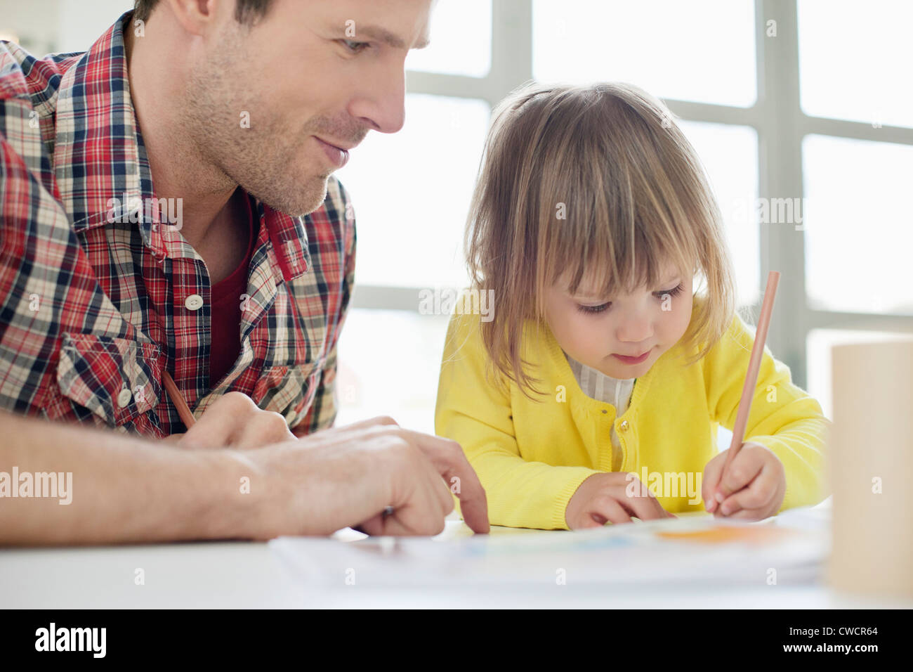Man teaching his daughter Stock Photo - Alamy