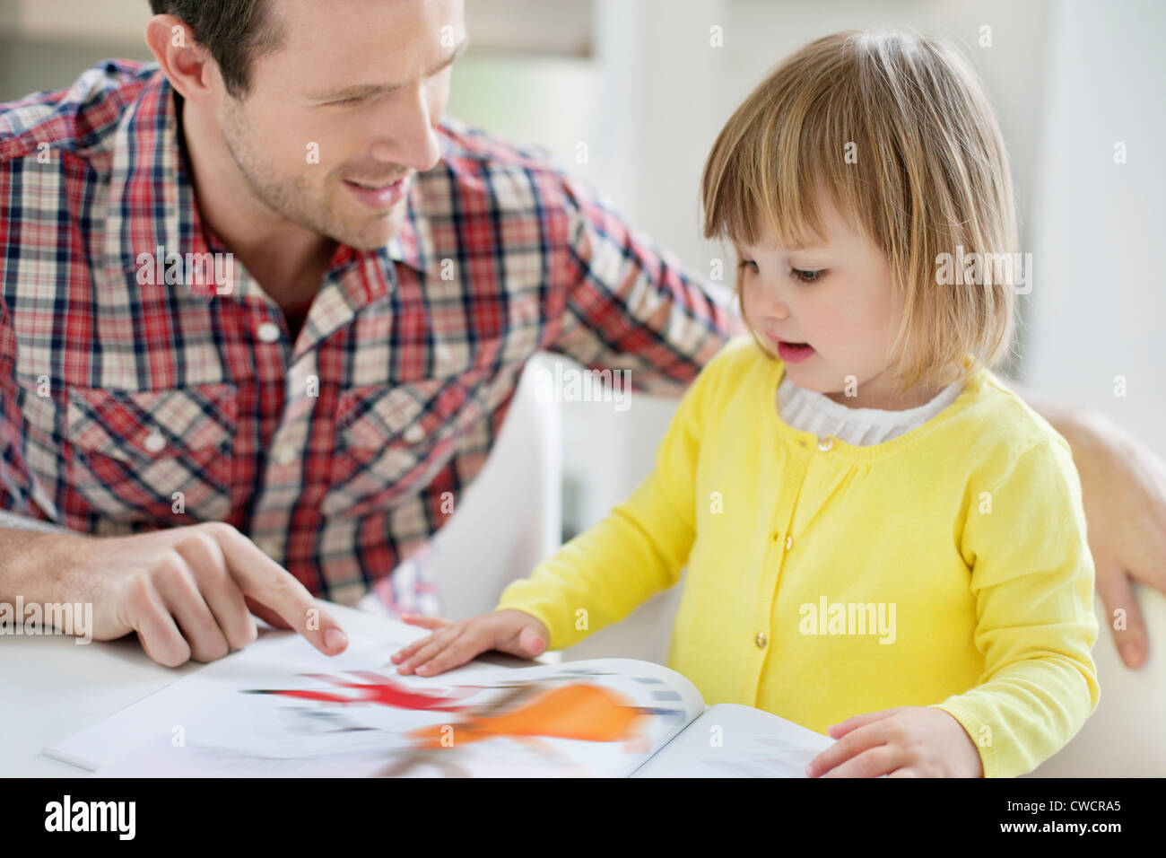 Man teaching his daughter Stock Photo - Alamy