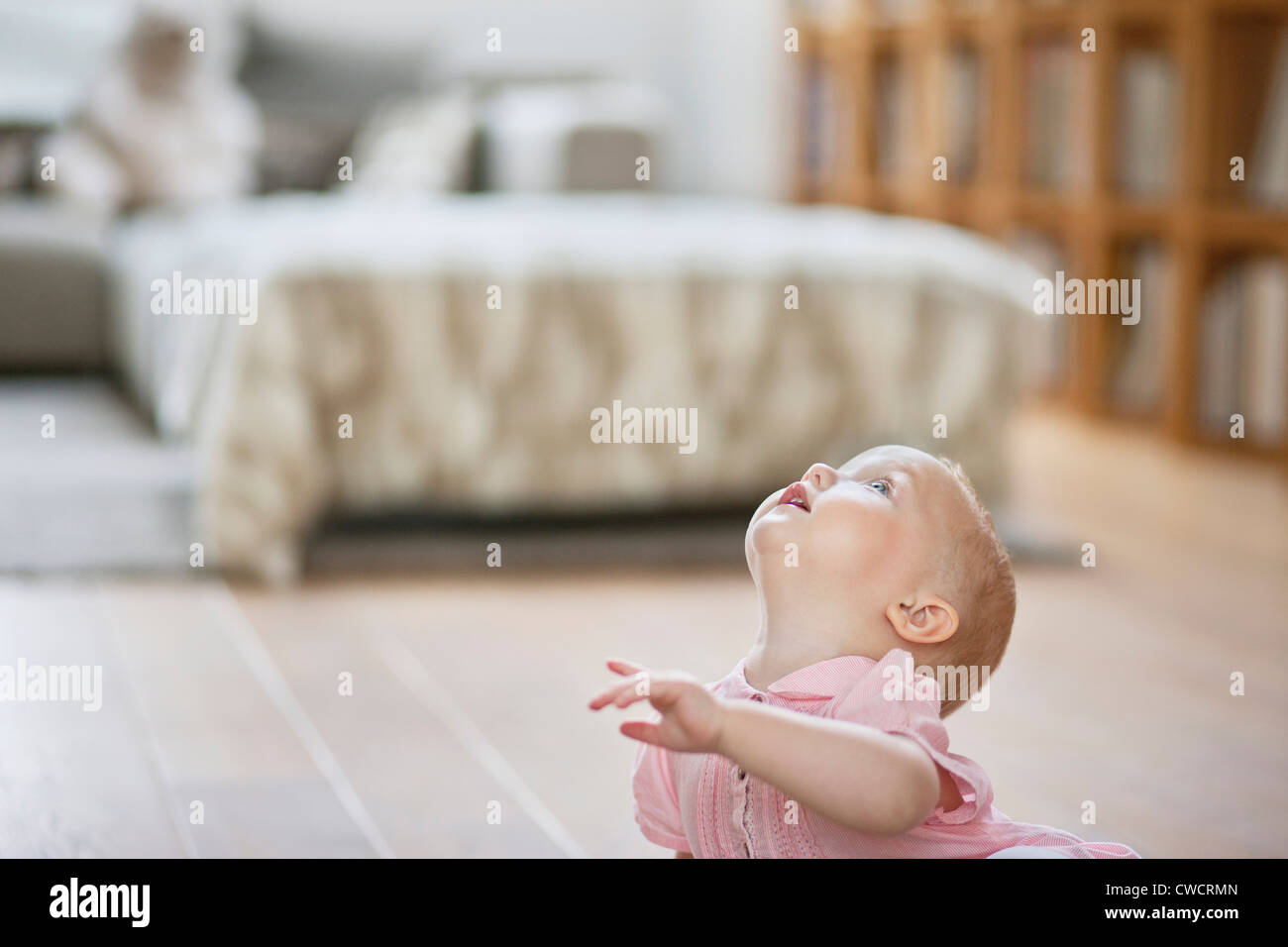 Close-up of a baby girl looking up Stock Photo - Alamy