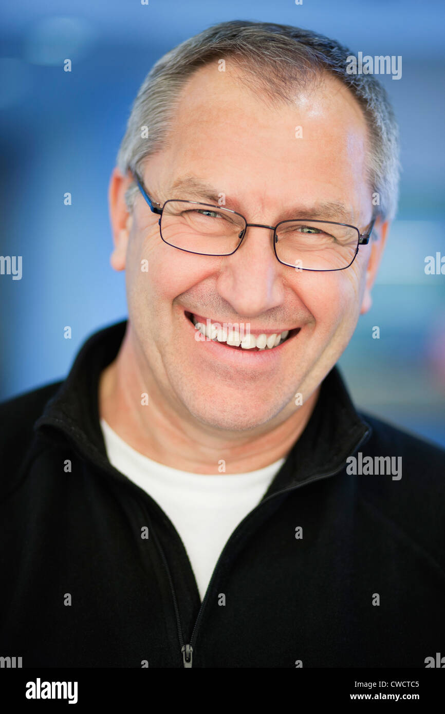 Portrait of a businessman smiling Stock Photo - Alamy