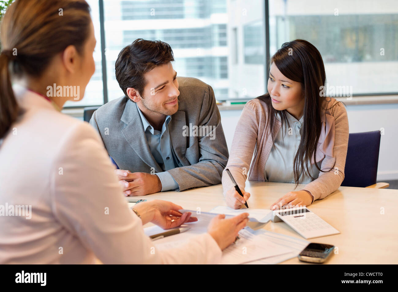 Asian female signing documents hi-res stock photography and images - Alamy