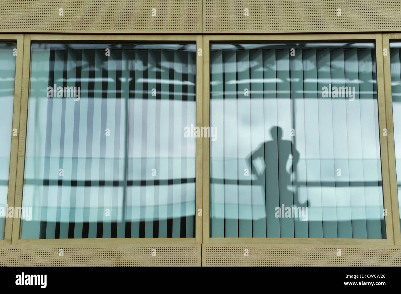 Reflection of a person on the glass of an office window Stock Photo - Alamy