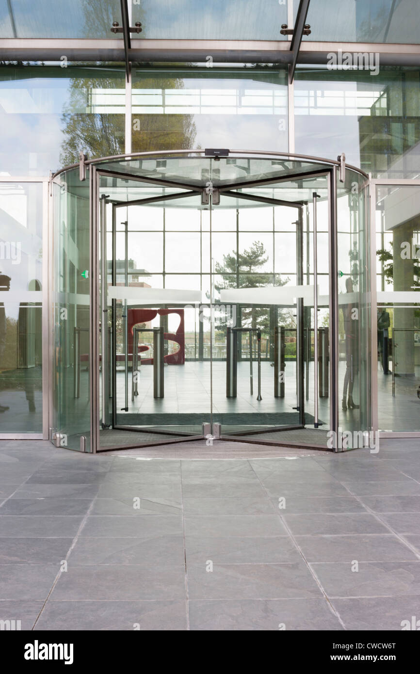 Revolving door of an office building Stock Photo - Alamy