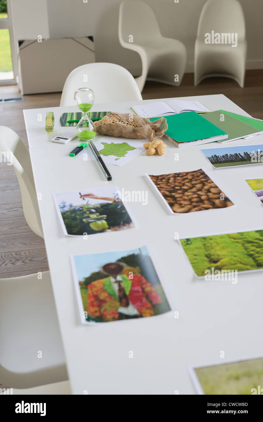 Ecology sustainable development related photographs on a table Stock ...