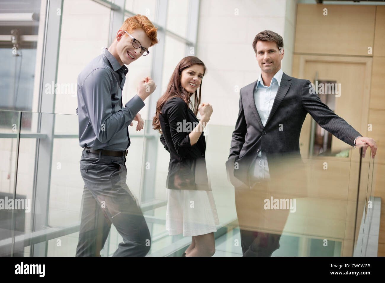 Business executives cheering up in an office Stock Photo - Alamy