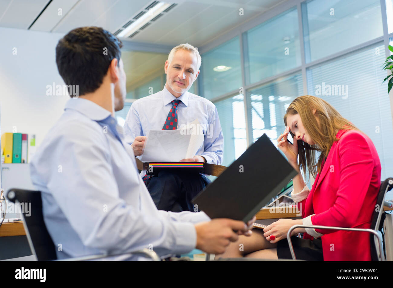 Business executives discussing in an office Stock Photo - Alamy