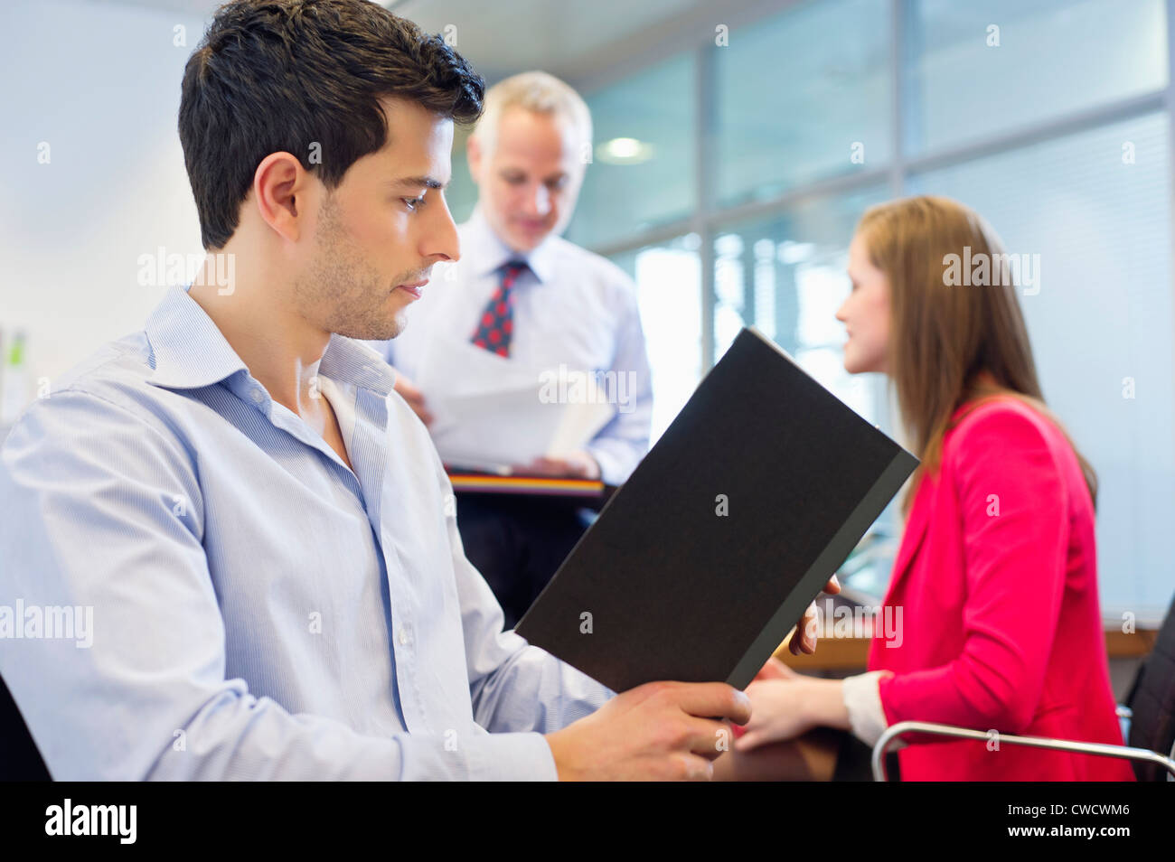 Business executives working in an office Stock Photo - Alamy