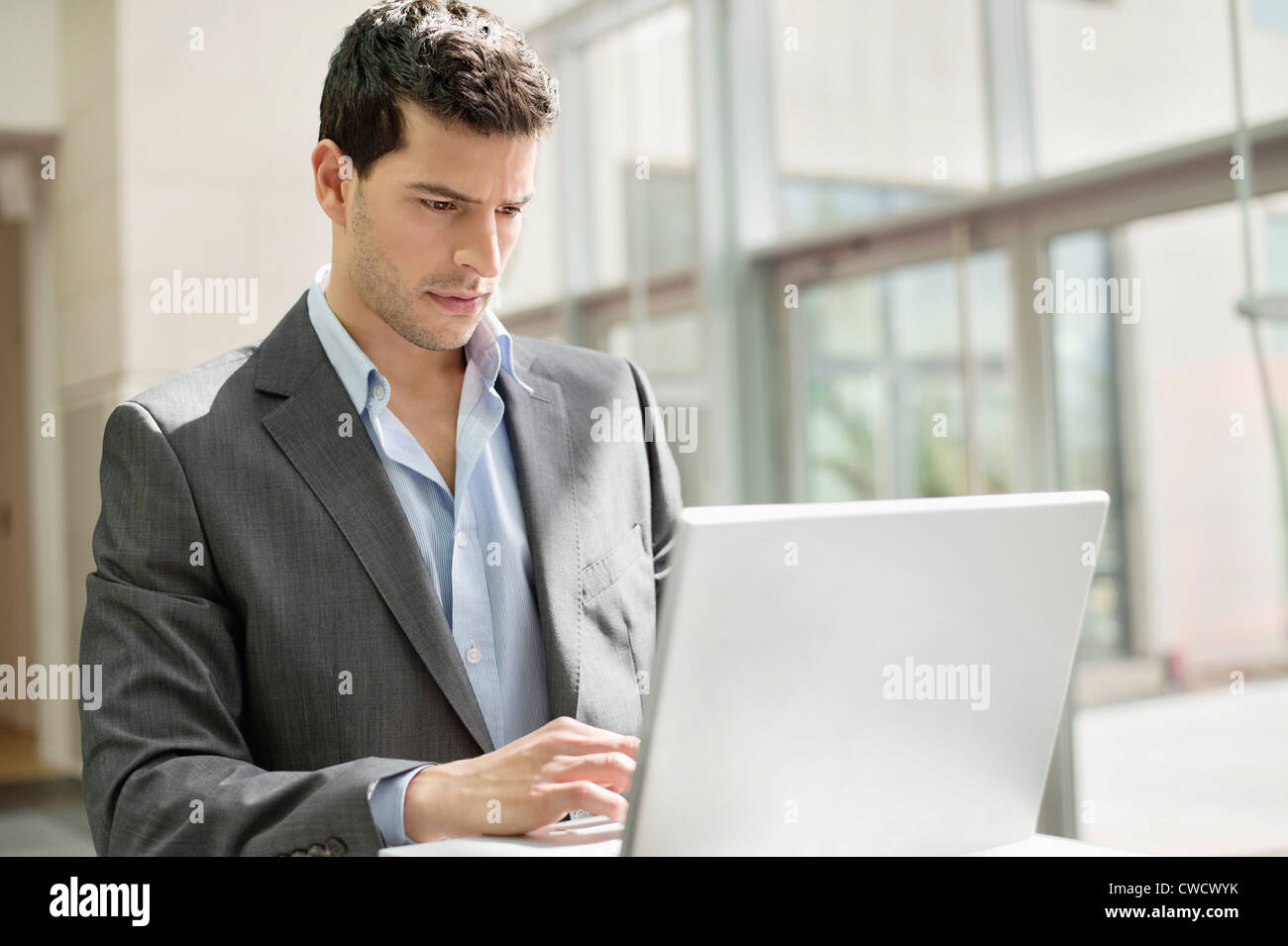 Businessman in the office working with laptop hi-res stock photography ...