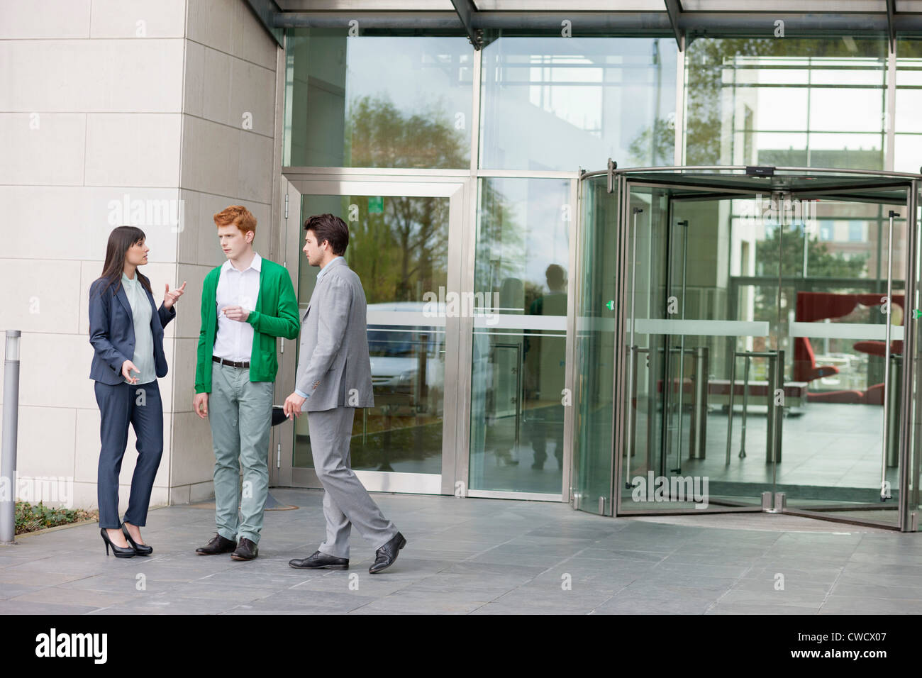 Business executives smoking in front of an office building Stock Photo ...