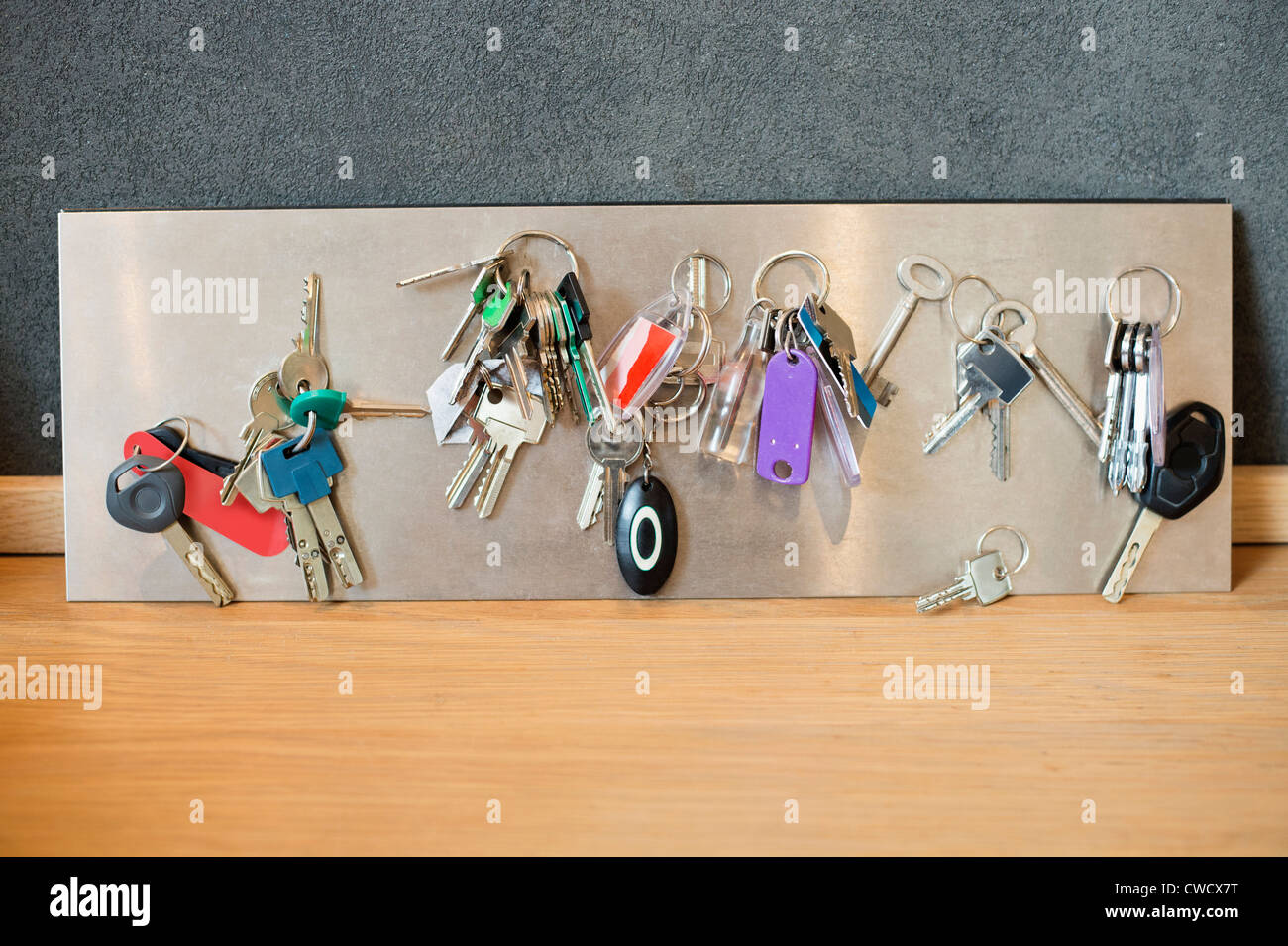 Assorted keys on a metal sheet Stock Photo - Alamy