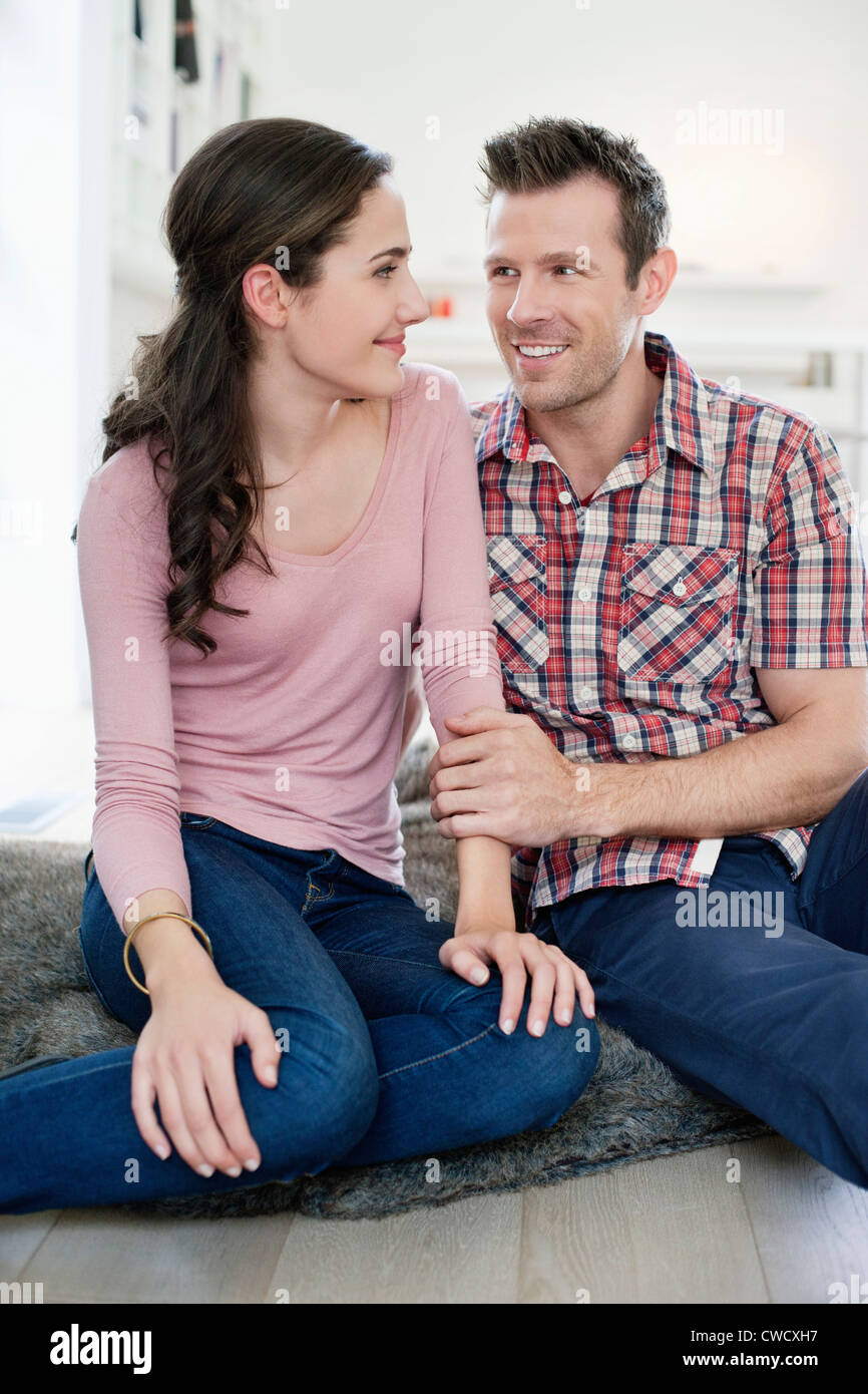 Couple smiling at each other Stock Photo - Alamy