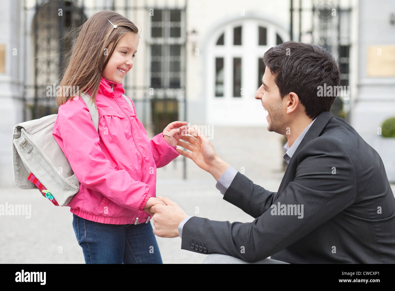 Man talking to his daughter Stock Photo - Alamy