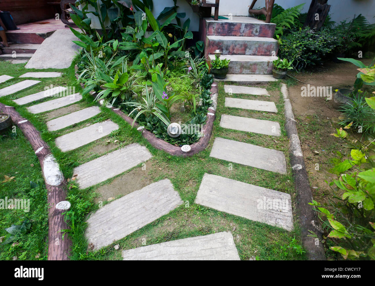 Stone paved footpath through garden Stock Photo - Alamy