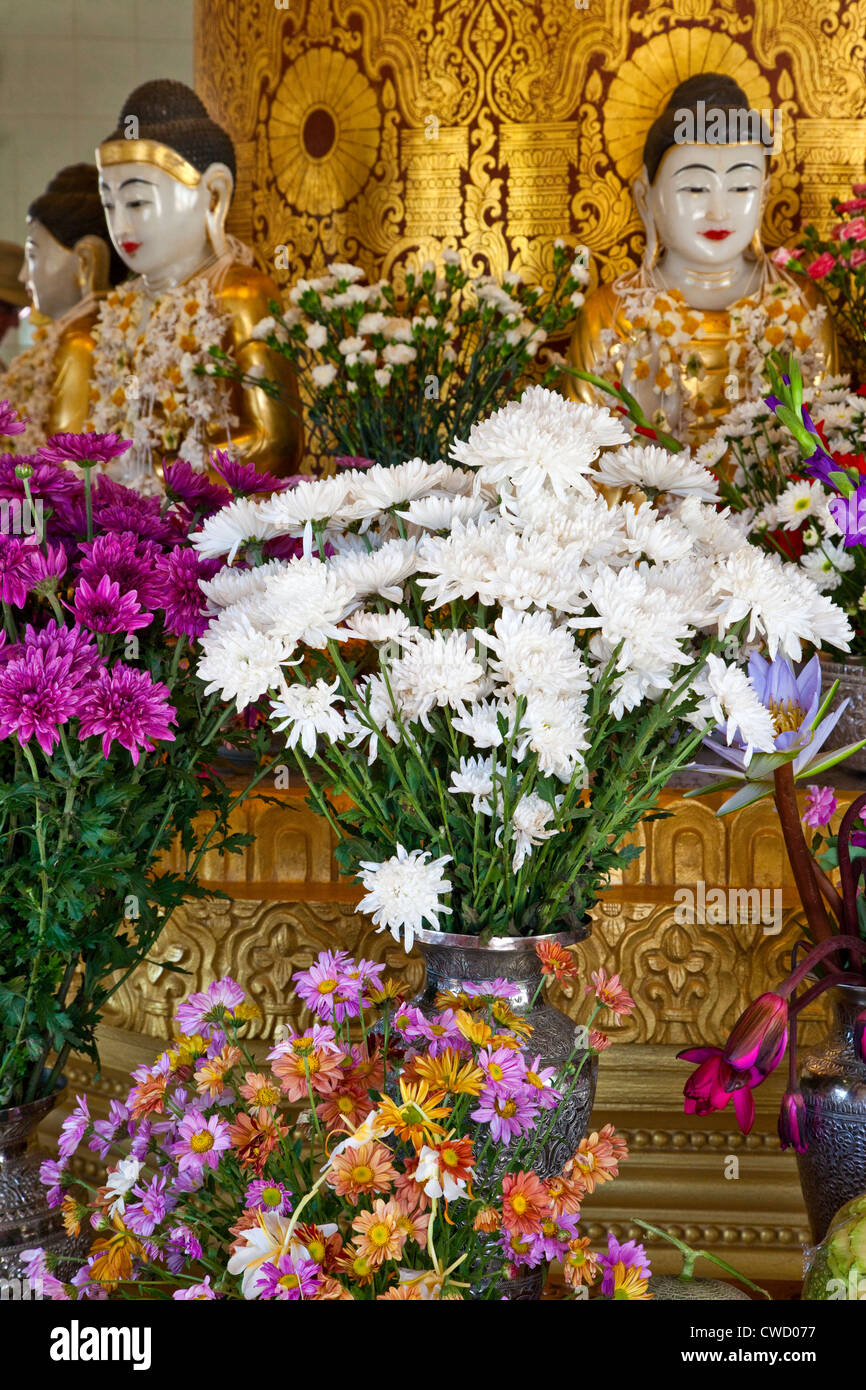 Myanmar, Burma. Offerings at a Buddhist Shrine at the Zayar Thein Gyi ...
