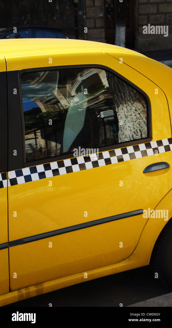 Detail of a typical taxi door yellow painted Stock Photo - Alamy
