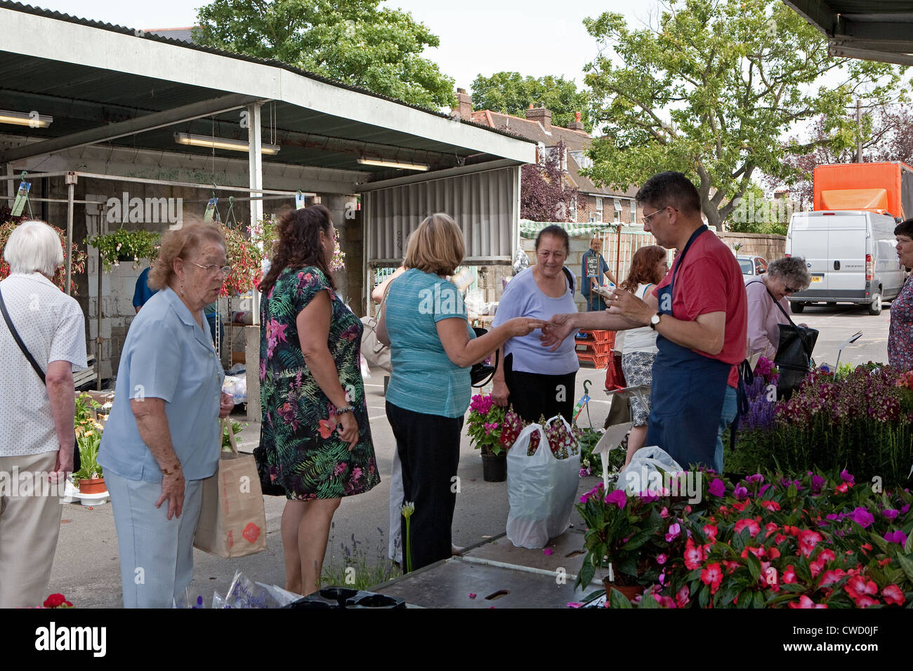 A flower stall trading in the Bromley North Market in Bromley Kent ...