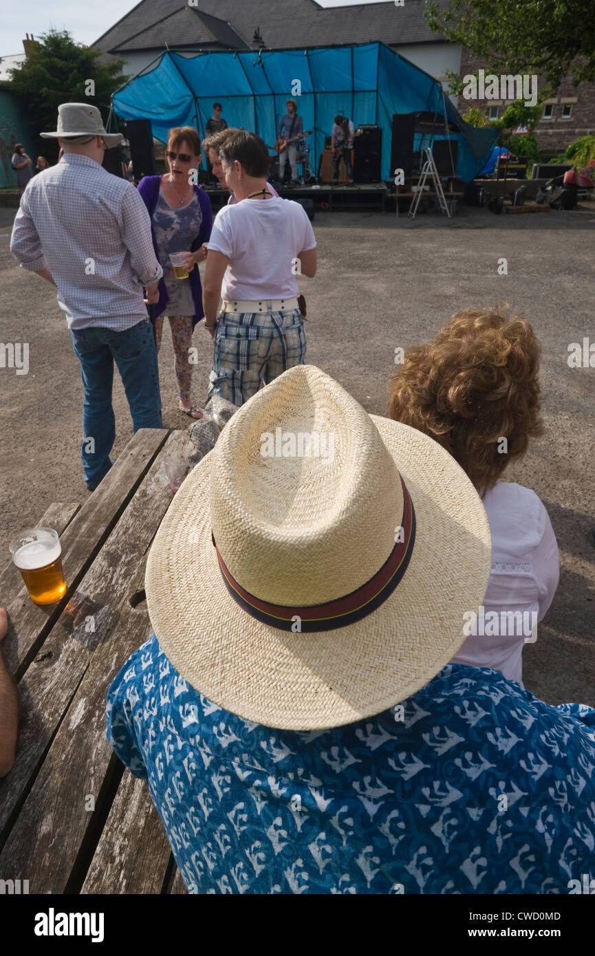 Rock band on stage in pub car park part of the Fringe Festival during ...