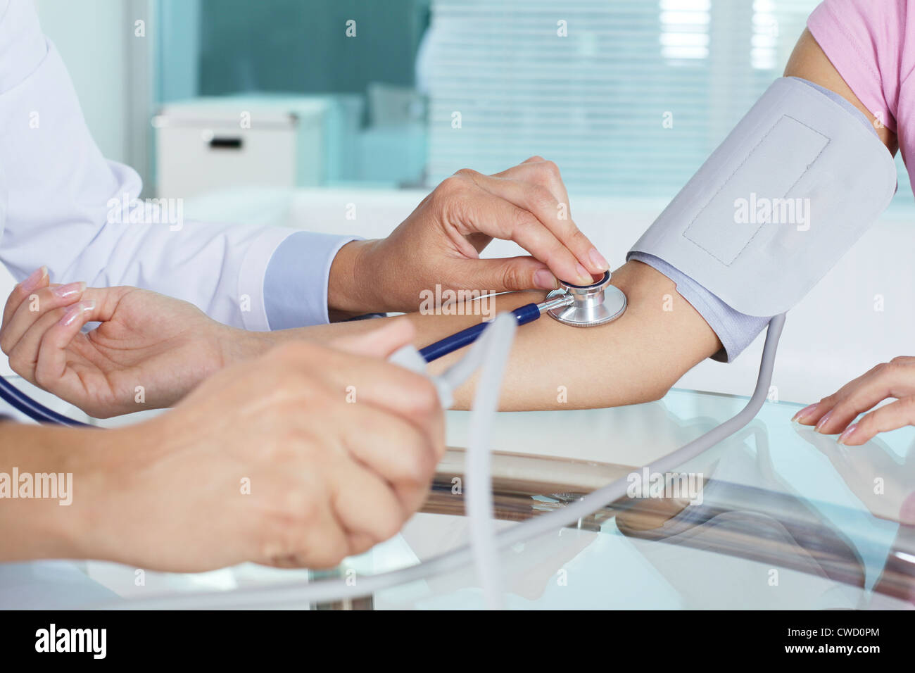 Close-up of patient’s arm during blood pressure measuring at medical ...