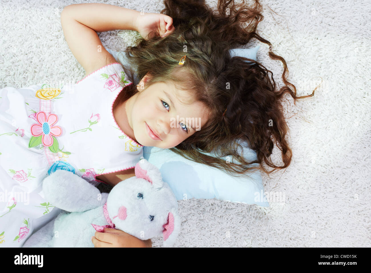 Portrait of lovely girl lying with teddybear Stock Photo - Alamy