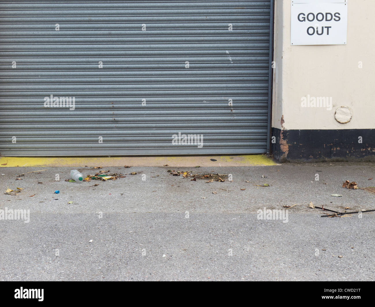 Good out area at a warehouse with roller door closed shut. Recession or ...