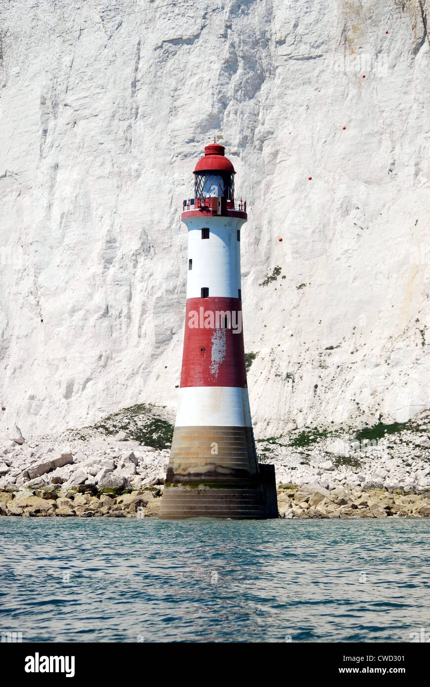 A view of Beachy Head lighthouse from the sea with cliffs behind Stock ...