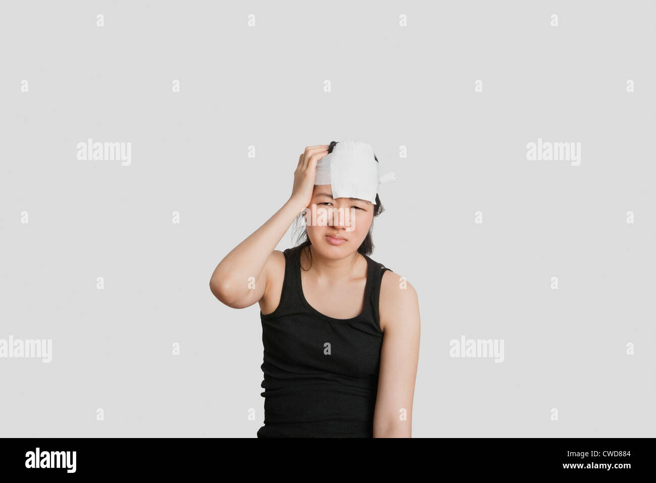 Portrait of a young female in pain with serious head injury Stock Photo ...