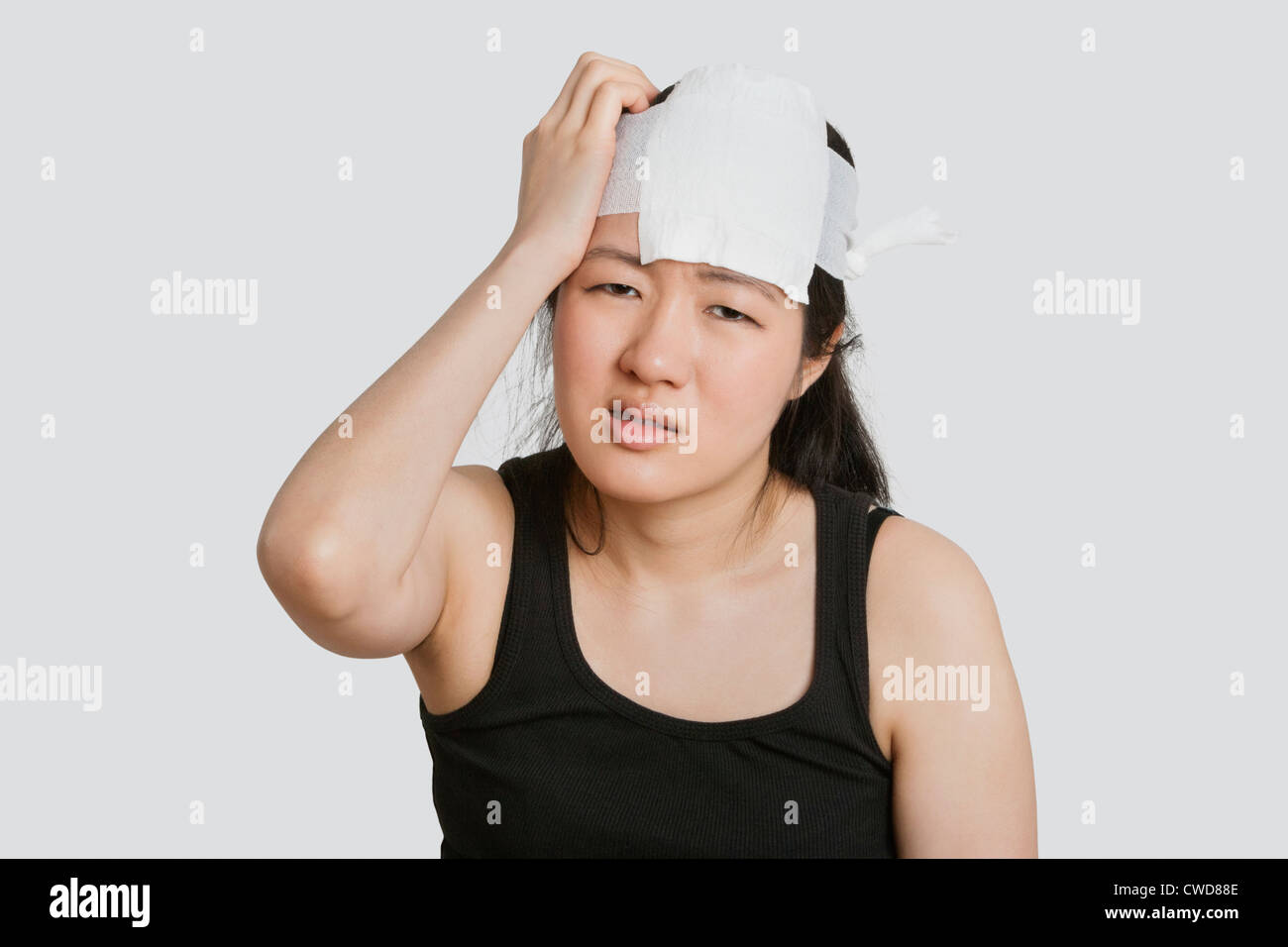 Portrait of a young female suffering from pain due to injury Stock ...