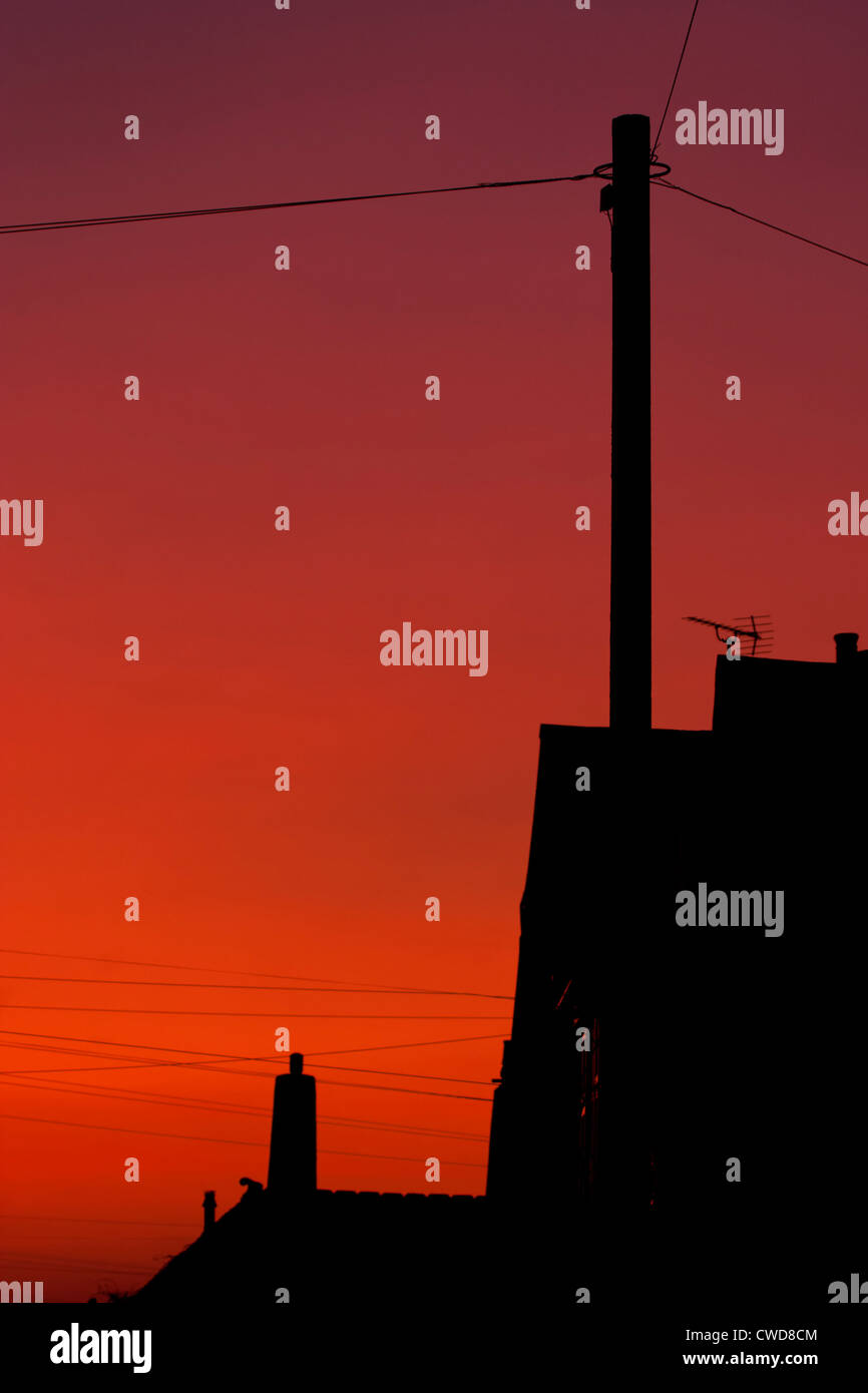 Sunset over rooftops Stock Photo - Alamy