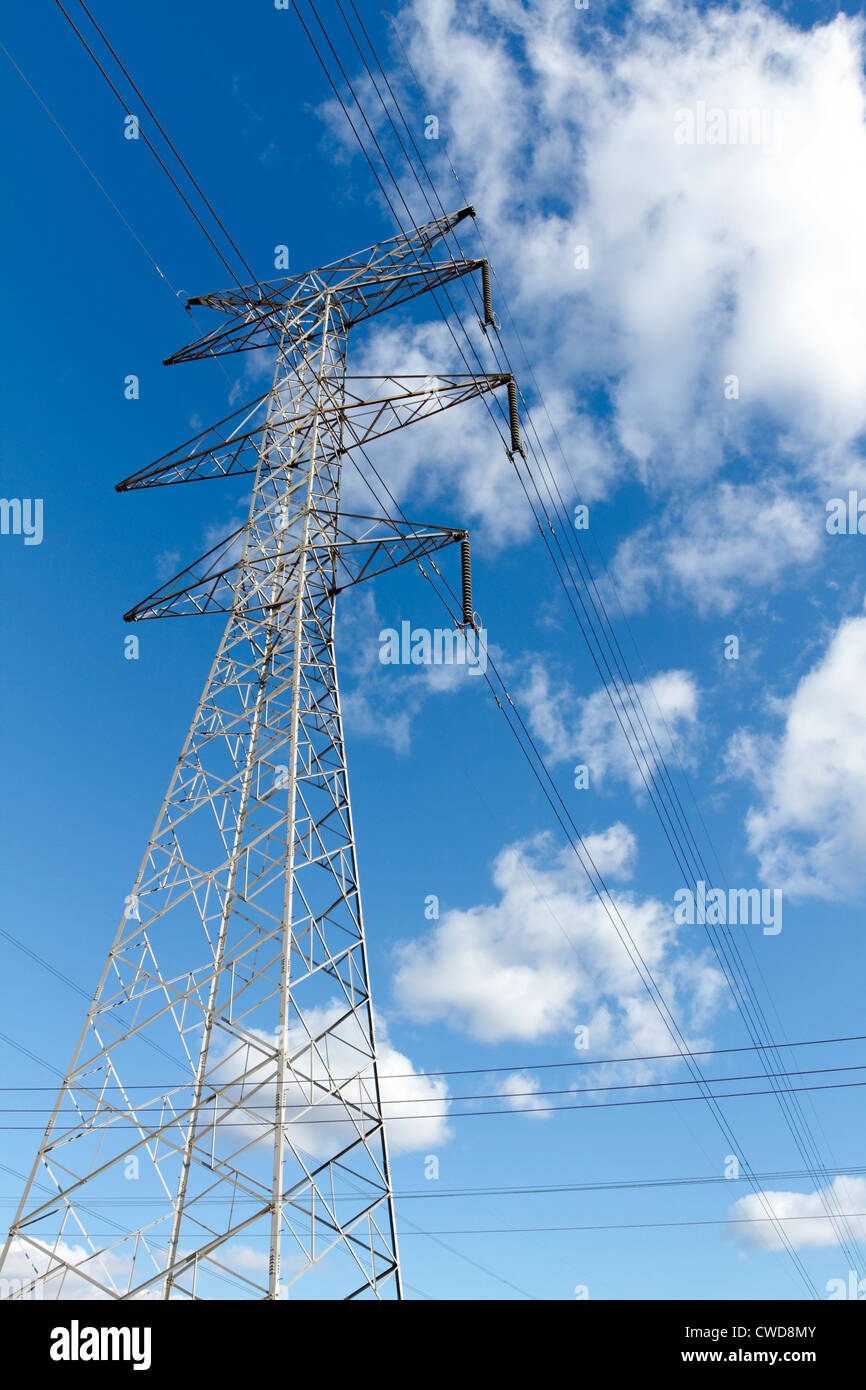 Looking upward to high tension electricity pylons Stock Photo - Alamy