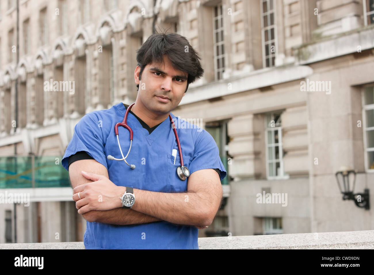 Portrait of an Indian male doctor standing with arms crossed Stock ...