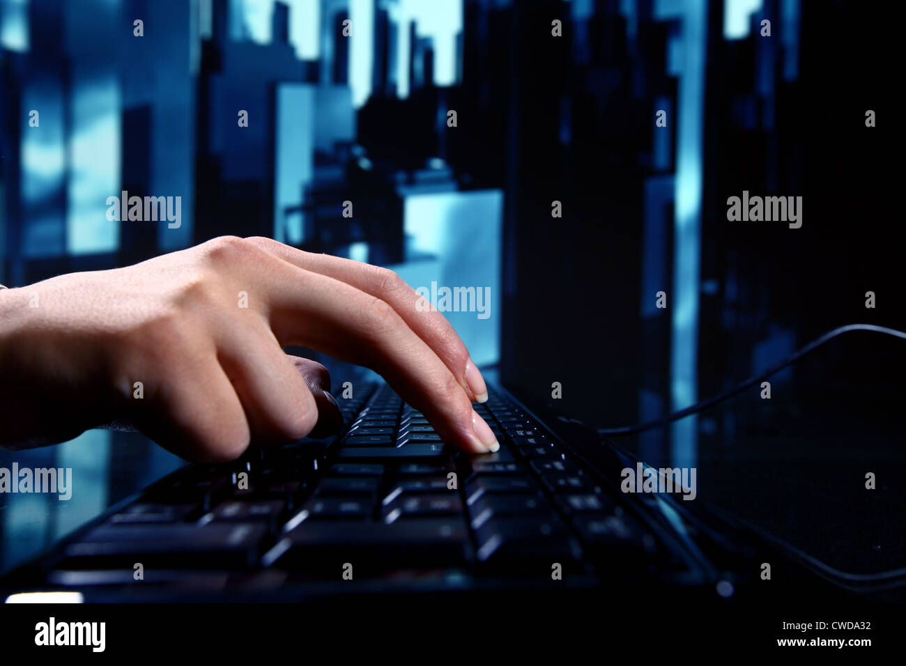 reseller work on keyboard skyscrapers on background Stock Photo - Alamy