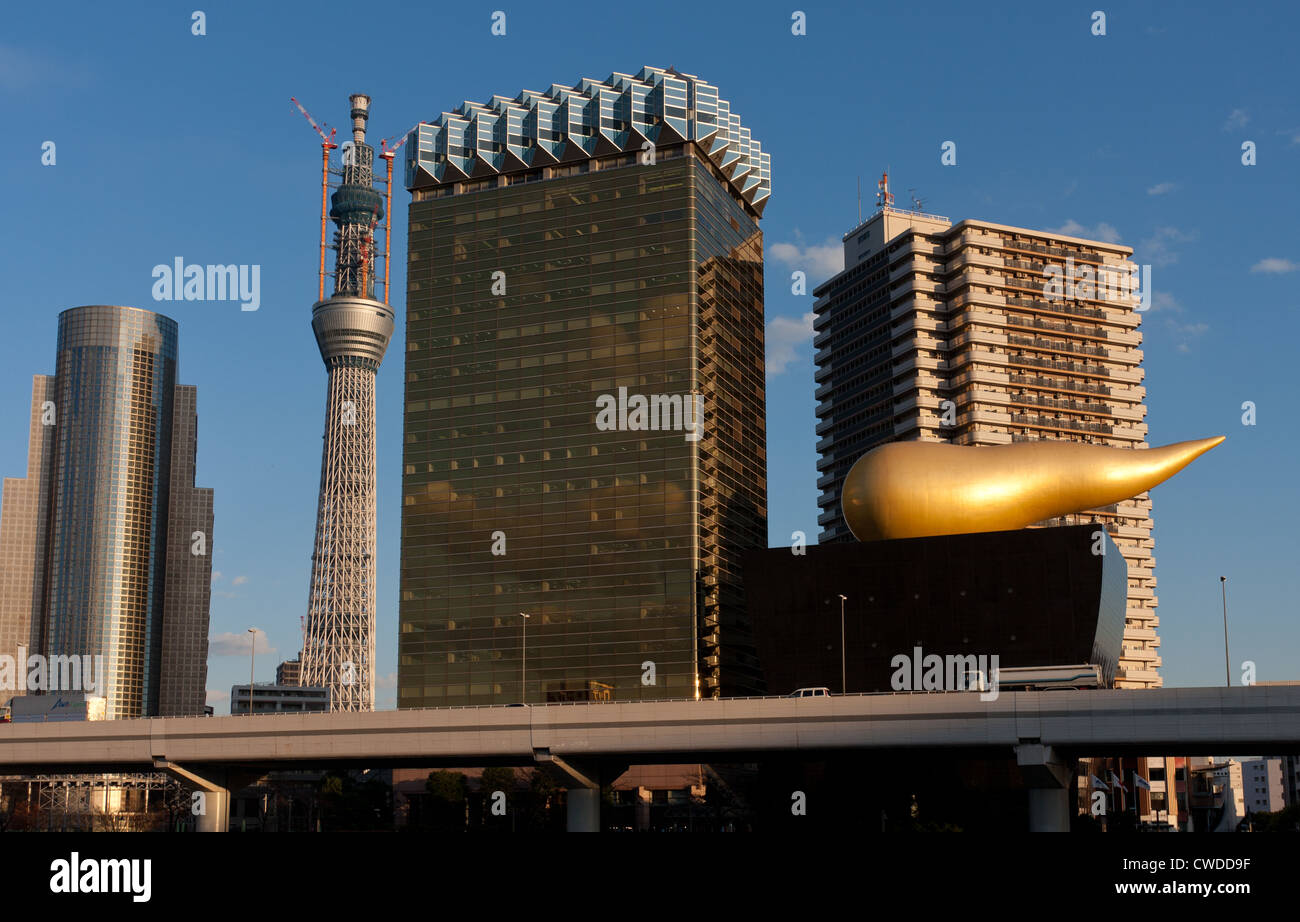 Tokyo Sky Tree under construction seen between the iconic Asahi beer ...