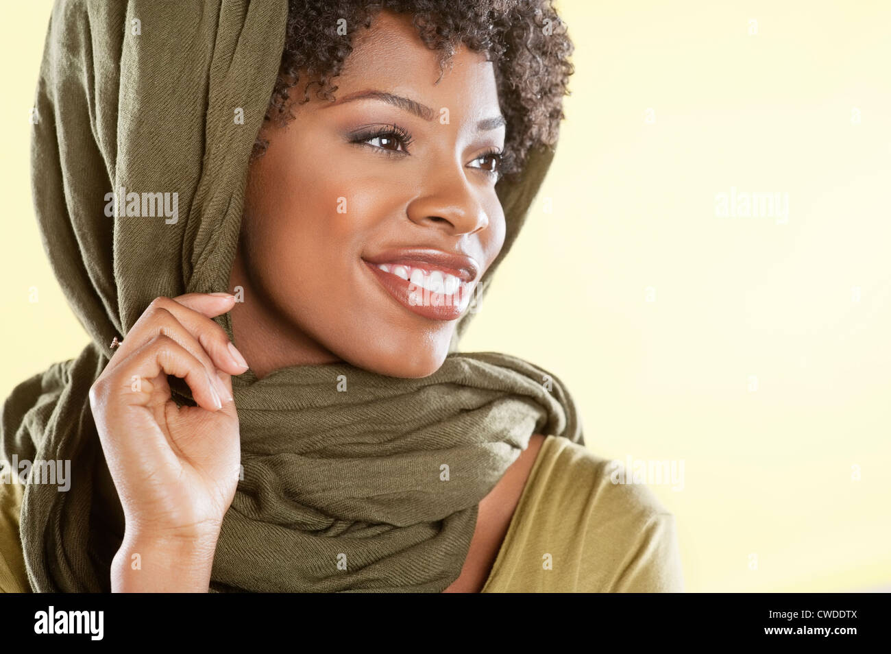 Happy African American woman with a stole over head looking away Stock ...