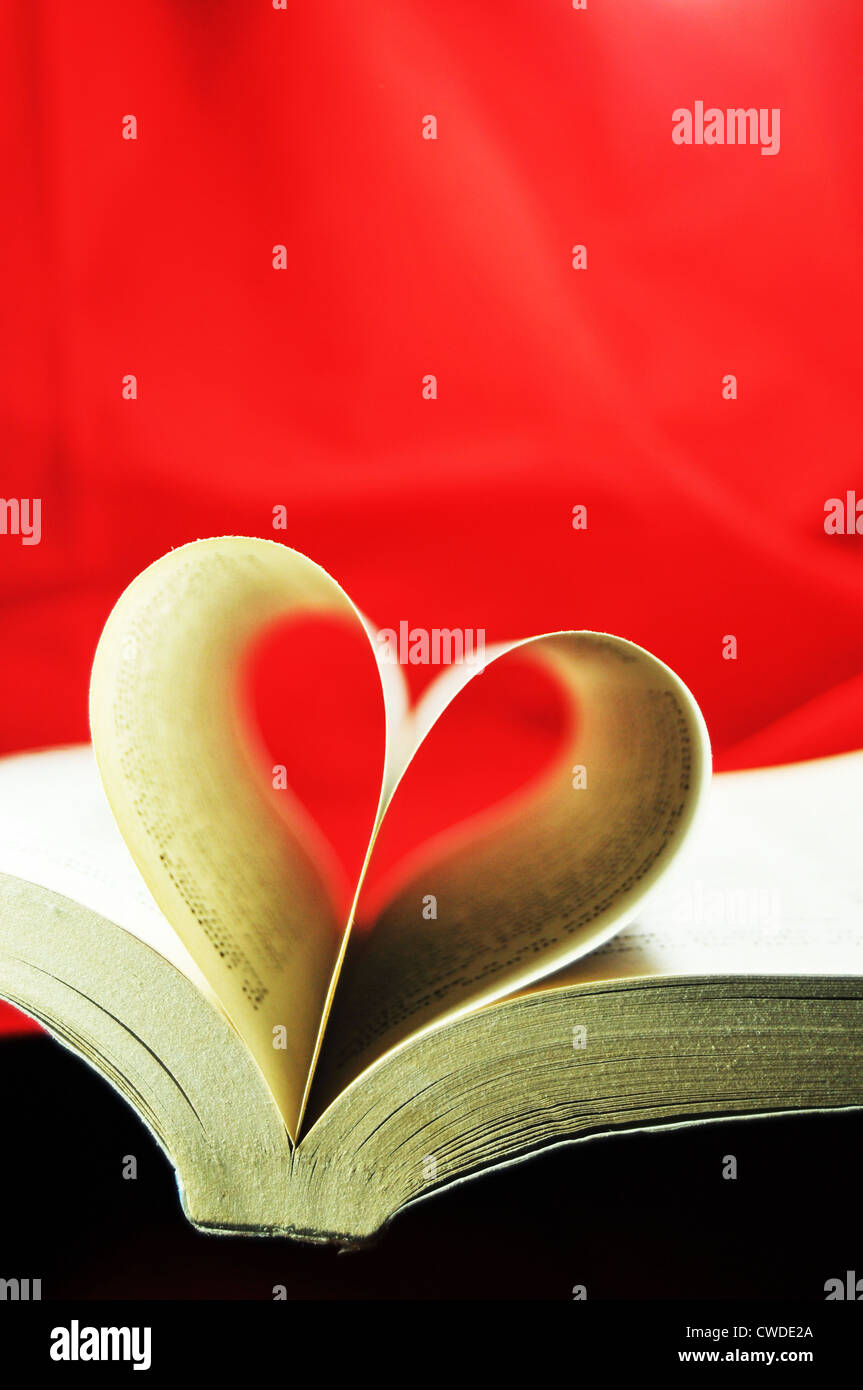 Love story concept with heart shaped book page Stock Photo - Alamy