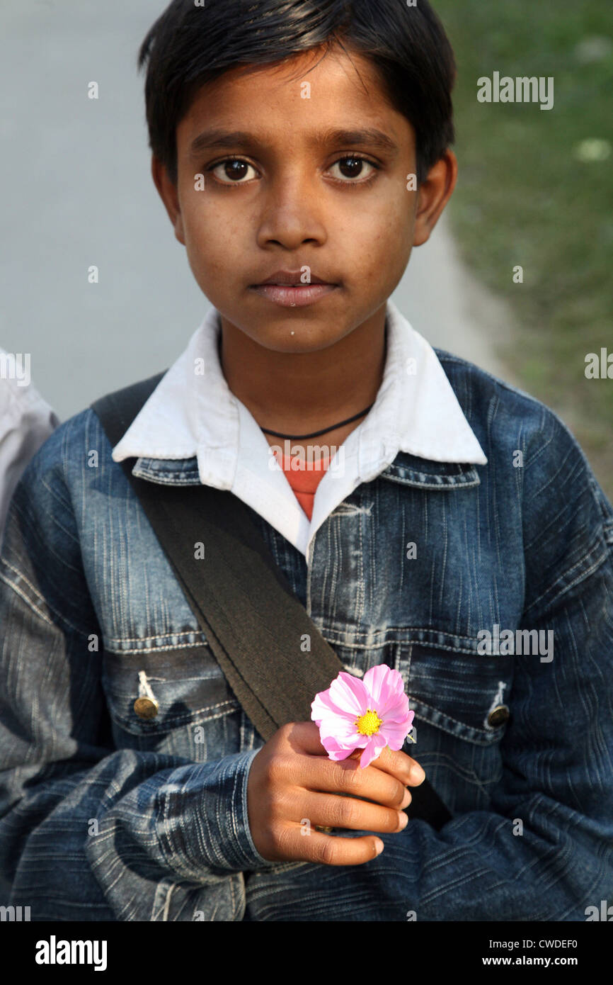 Indian teenager posing looking into the camera, on their way to school ...