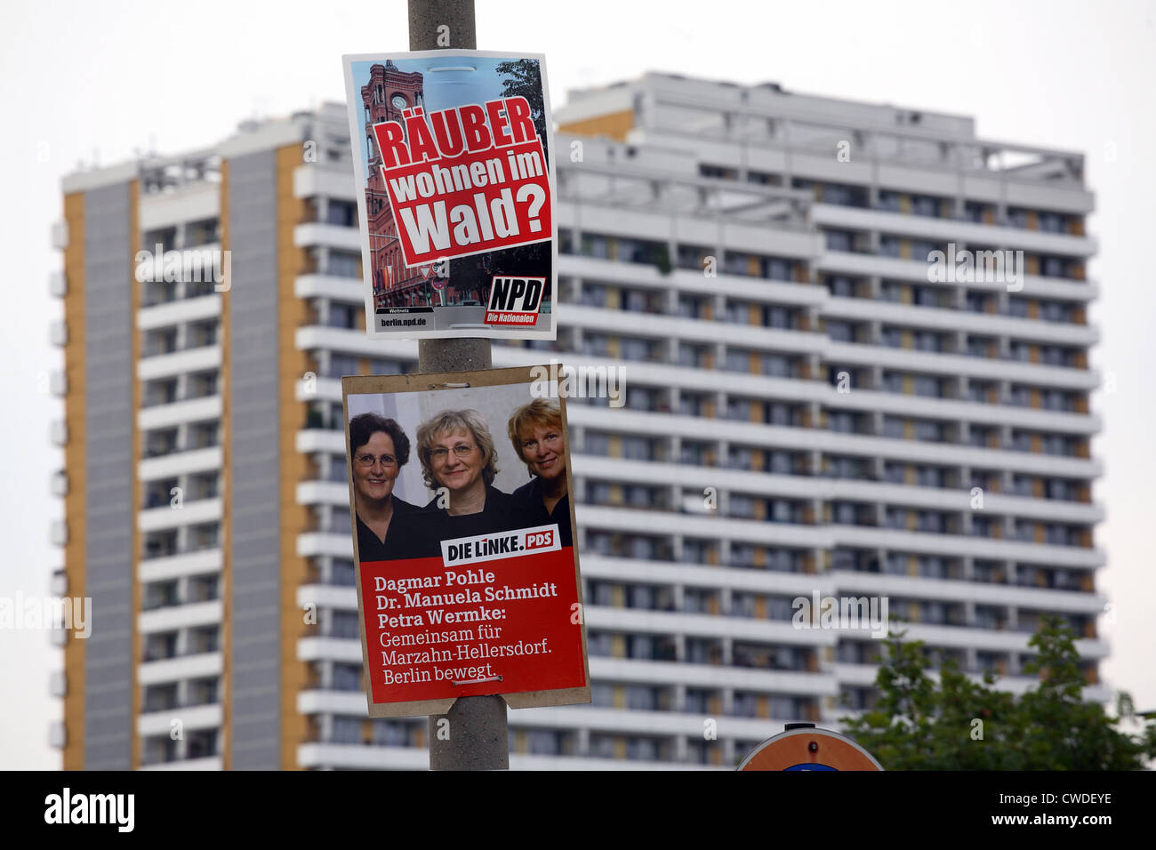 Election posters of PDS and NPD front tower in Berlin Stock Photo - Alamy